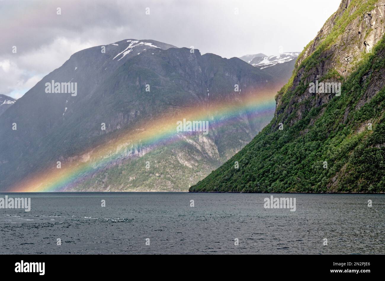 Beautiful rainbow over Geirangerfjord, located near the Geiranger ...