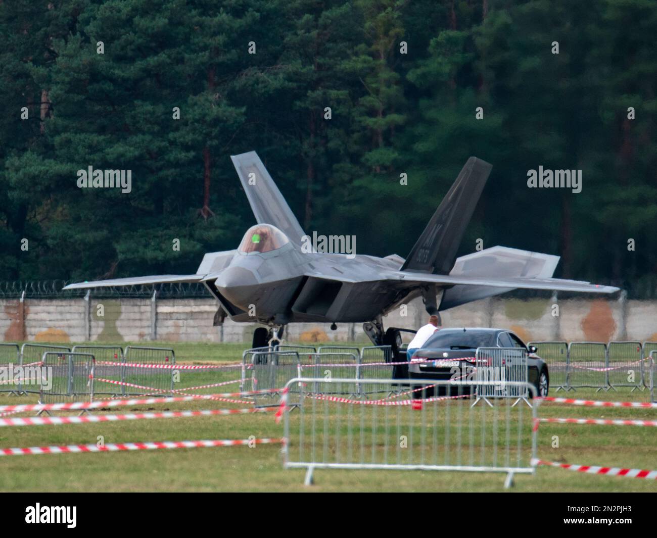 A closeup of Lockheed Martin F-22 Raptor on runway at an air show in ...