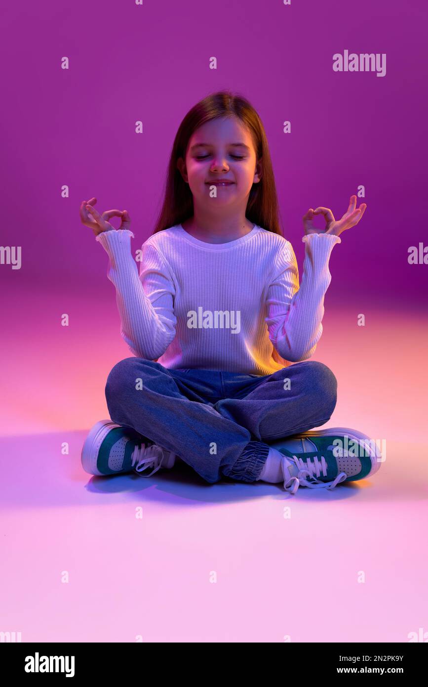 Meditation. Relaxation. Portrait of little girl, child in casual ...