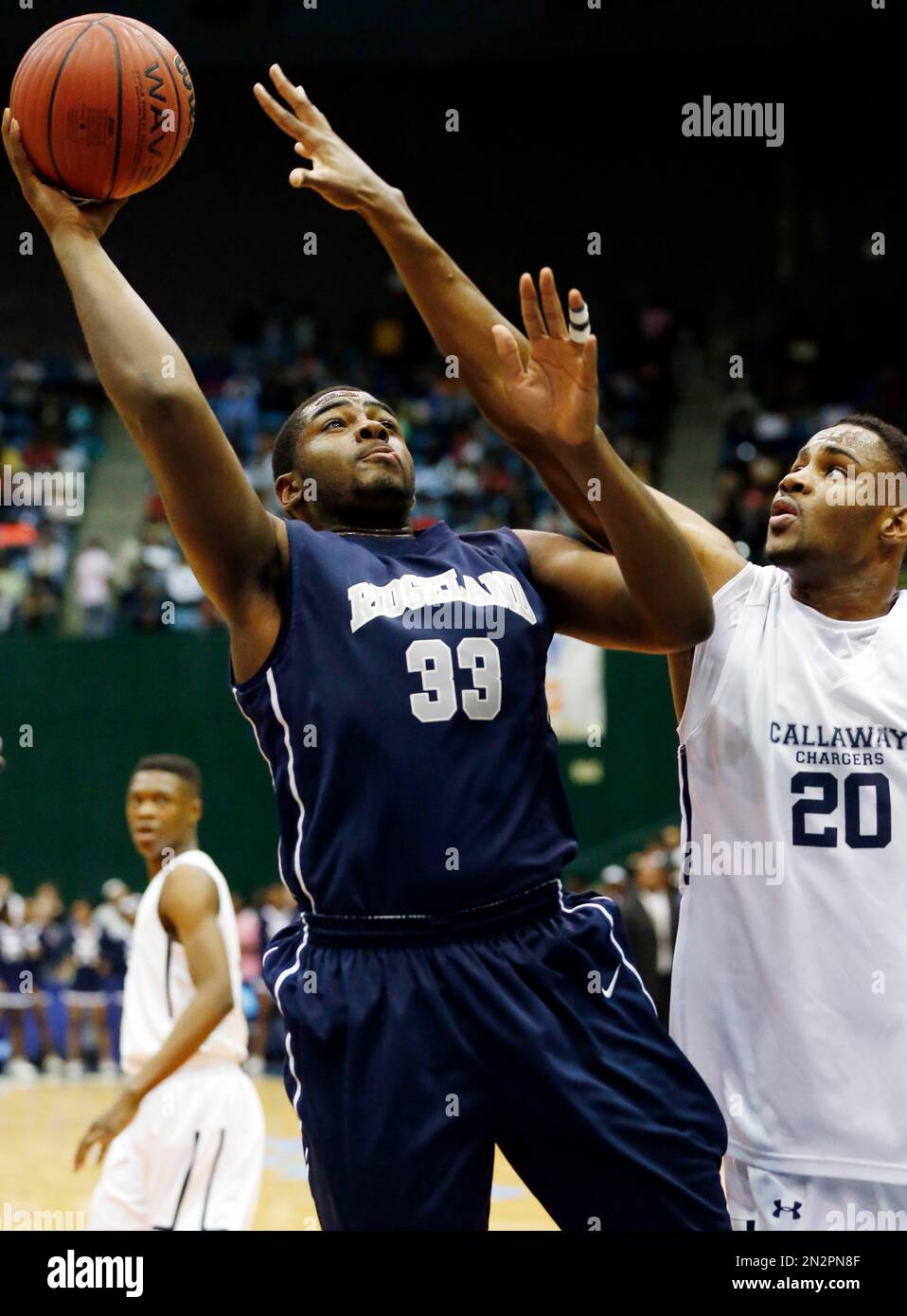 Ridgeland’s KeyShaun Simmons (33) attempts a shot over the defense of ...