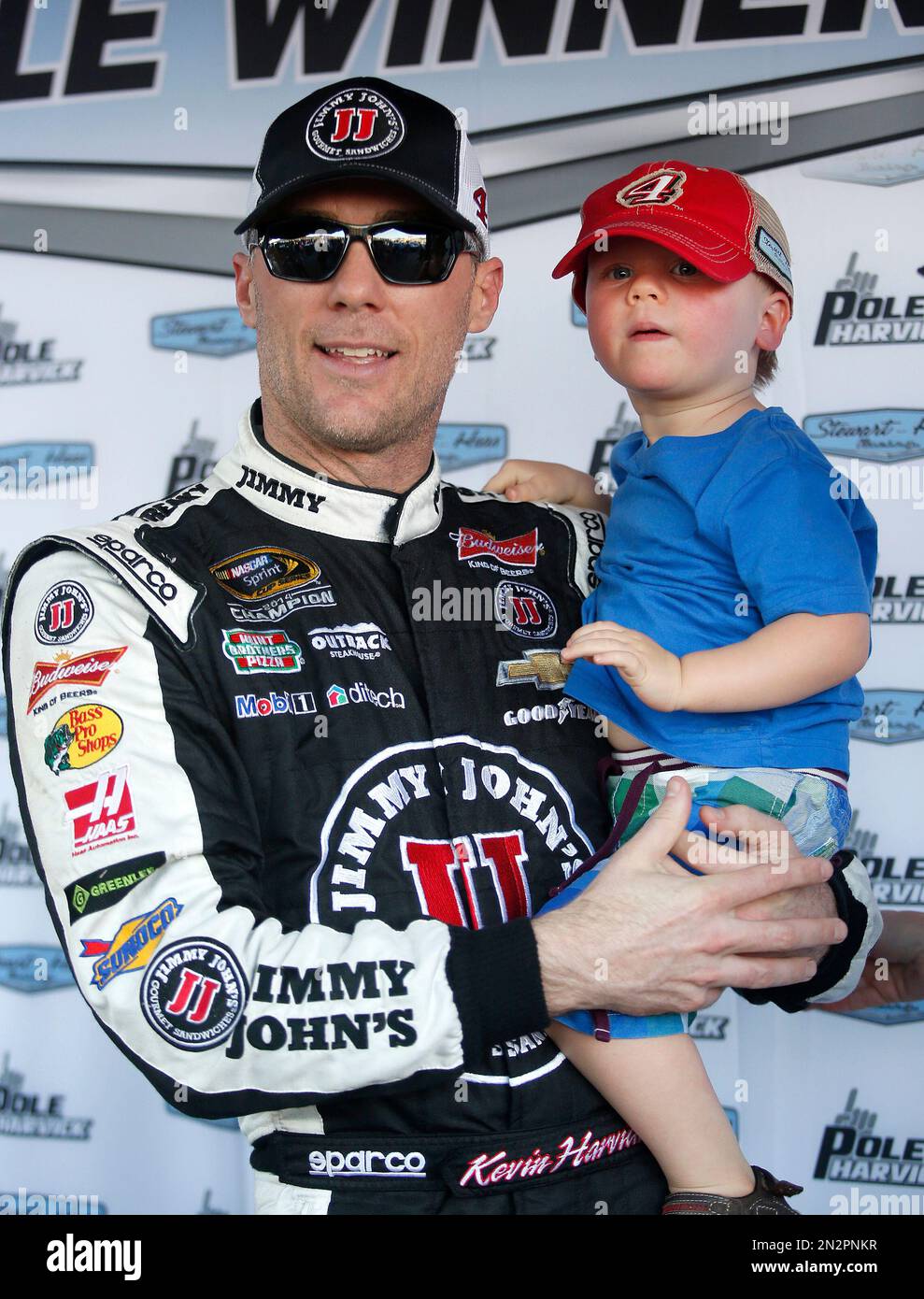 Kevin Harvick poses with his son Keelan after winning the pole for ...