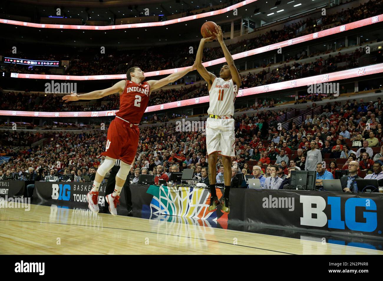 Maryland's Jared Nickens (11) shoots over Nick Zeisloft in the second ...