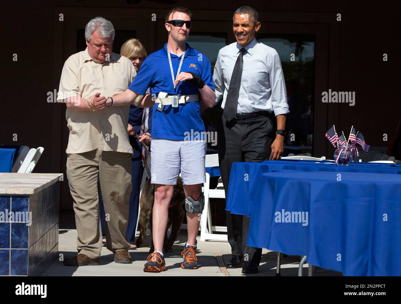 President Barack Obama, right, walks with Army Ranger Sgt. 1st Class ...