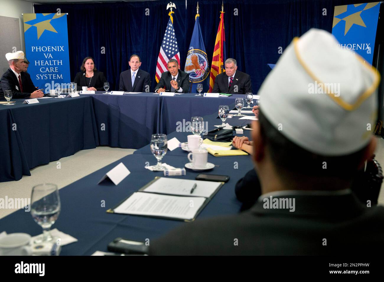 President Barack Obama, center, sits between new VA Secretary Robert ...