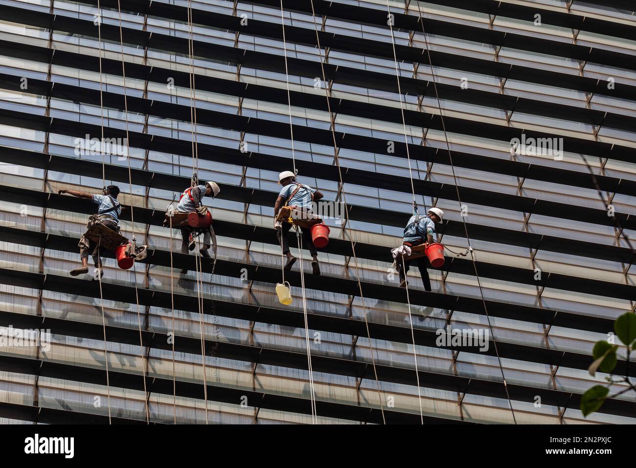 Dhaka, Bangladesh. 07th Feb, 2023. Workers clean a wall of a high-rise ...