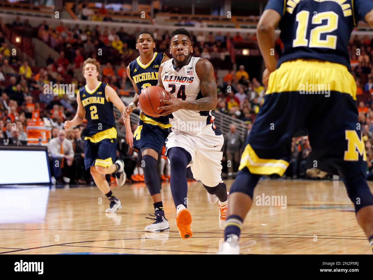 Illinois' Rayvonte Rice (24) drives against Michigan defense in the ...