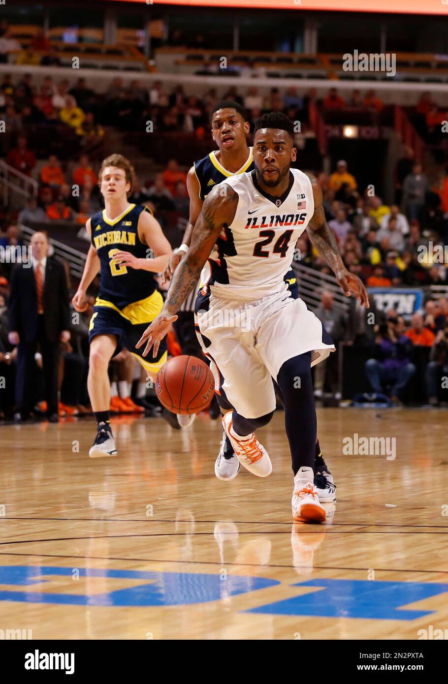 Illinois' Rayvonte Rice (24) drives against Michigan defense in the ...