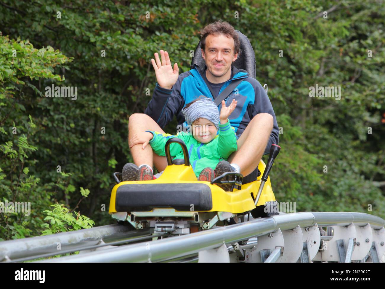 Bobsled in summer, Father and son Stock Photo - Alamy