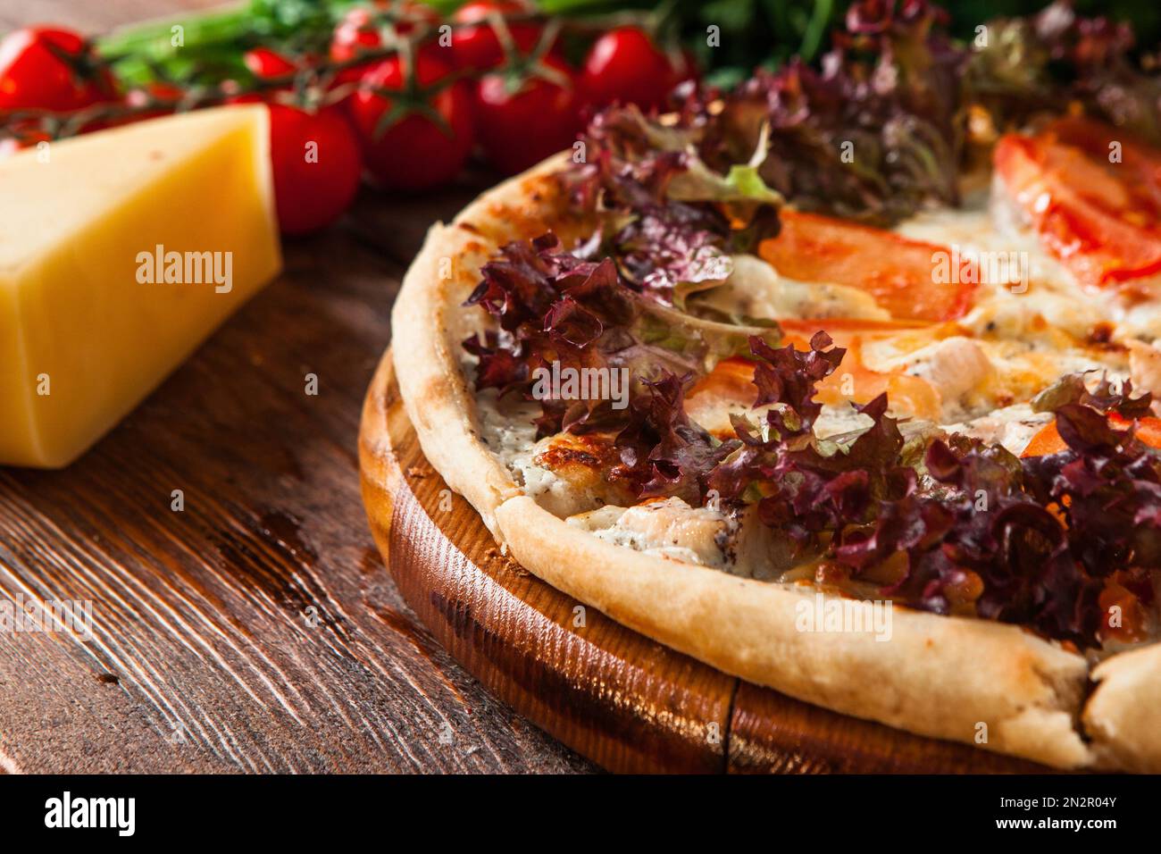 Fresh delicious italian pizza decorated with basil Stock Photo - Alamy