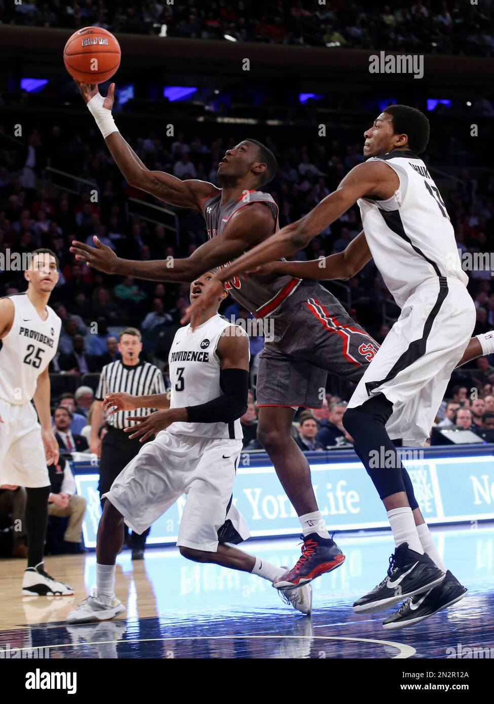 St. John's guard Rysheed Jordan (23) shoots past Providence center ...