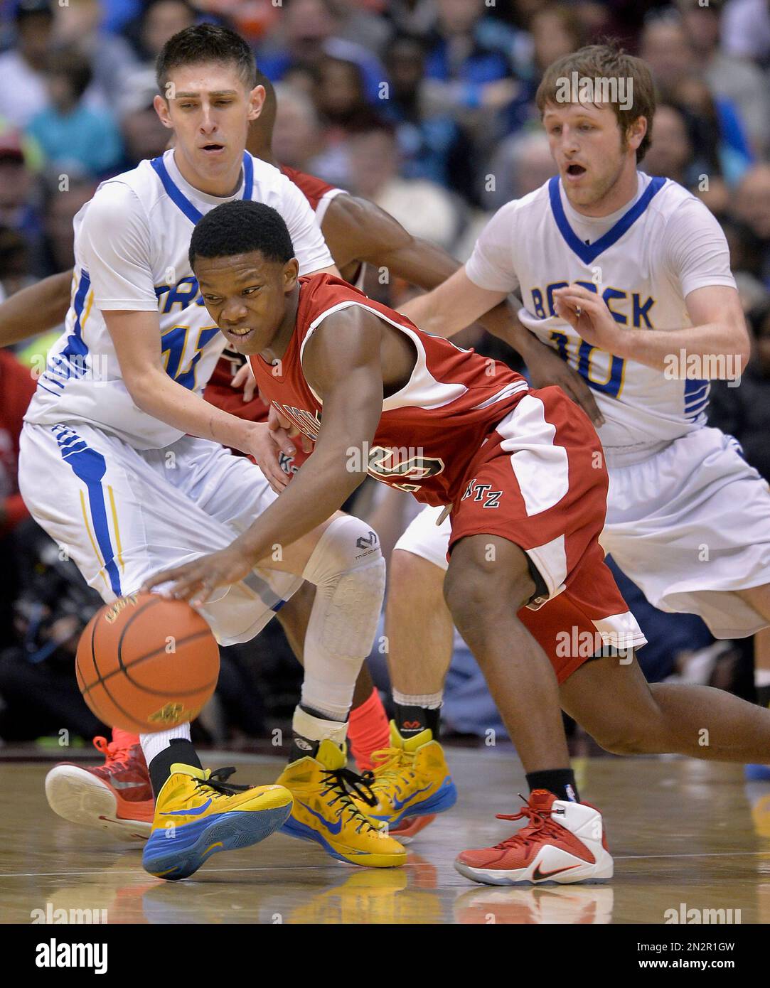 Kountze High School's Grayland Arnold, center, drives past Brock High ...
