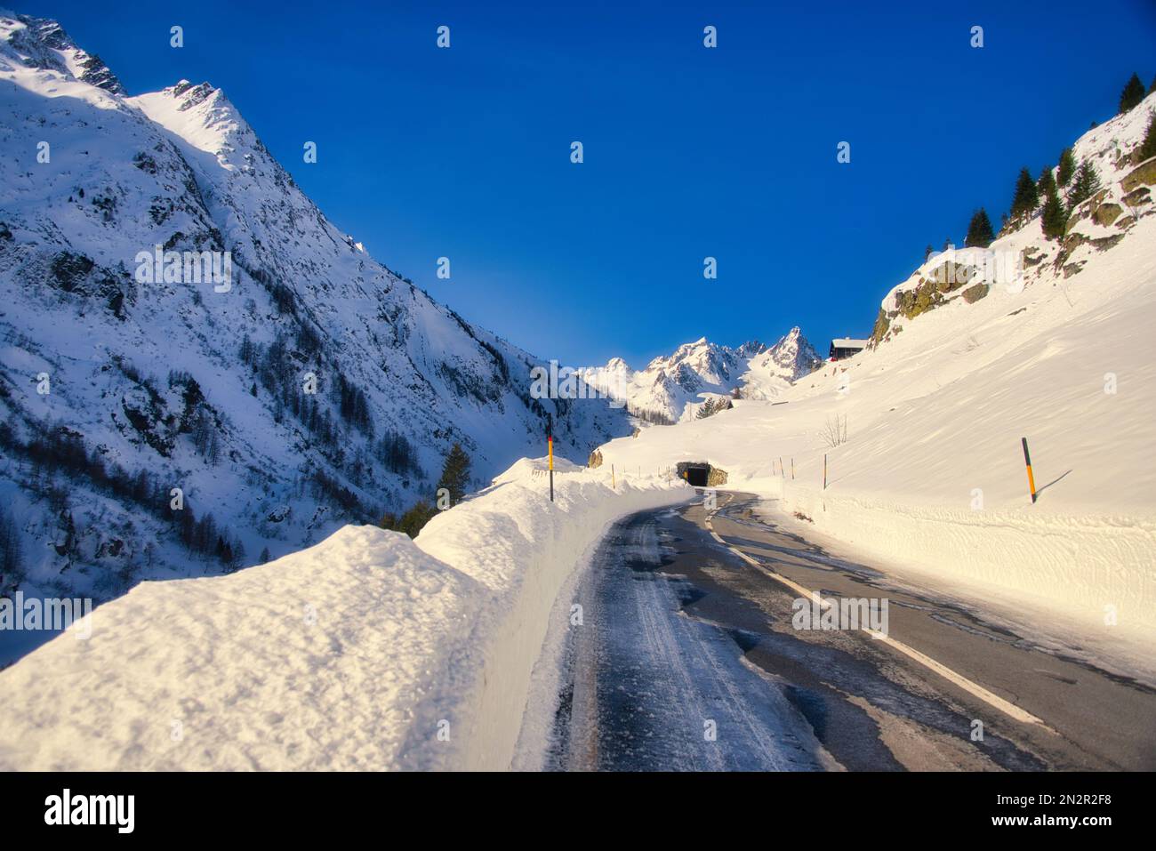 Susten pass through snowy mountains in winter, Switzerland Stock Photo ...