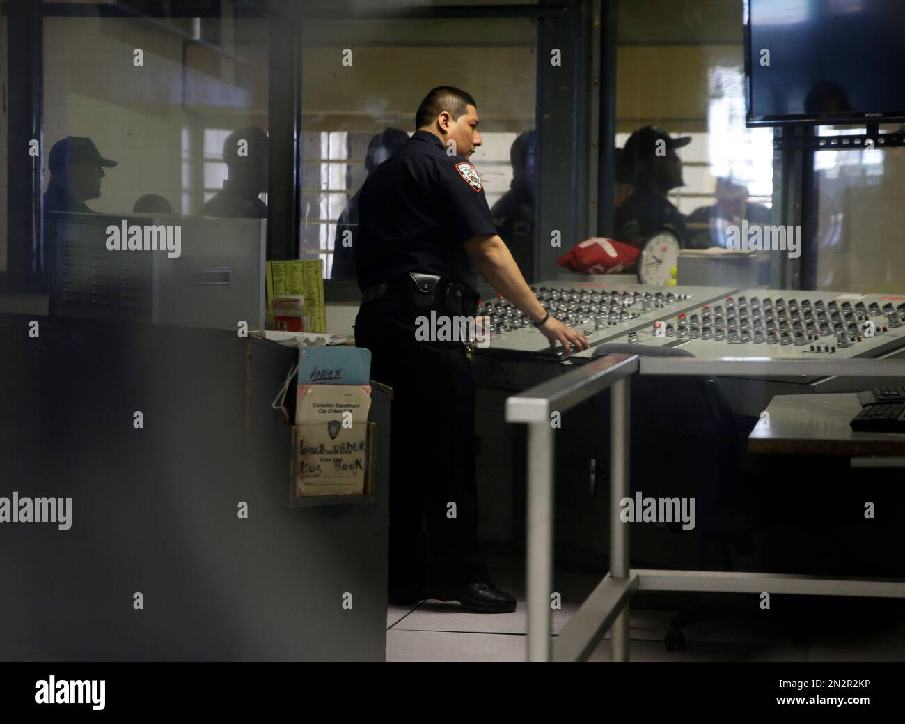 A corrections officer mans a security post in an enhanced supervision ...