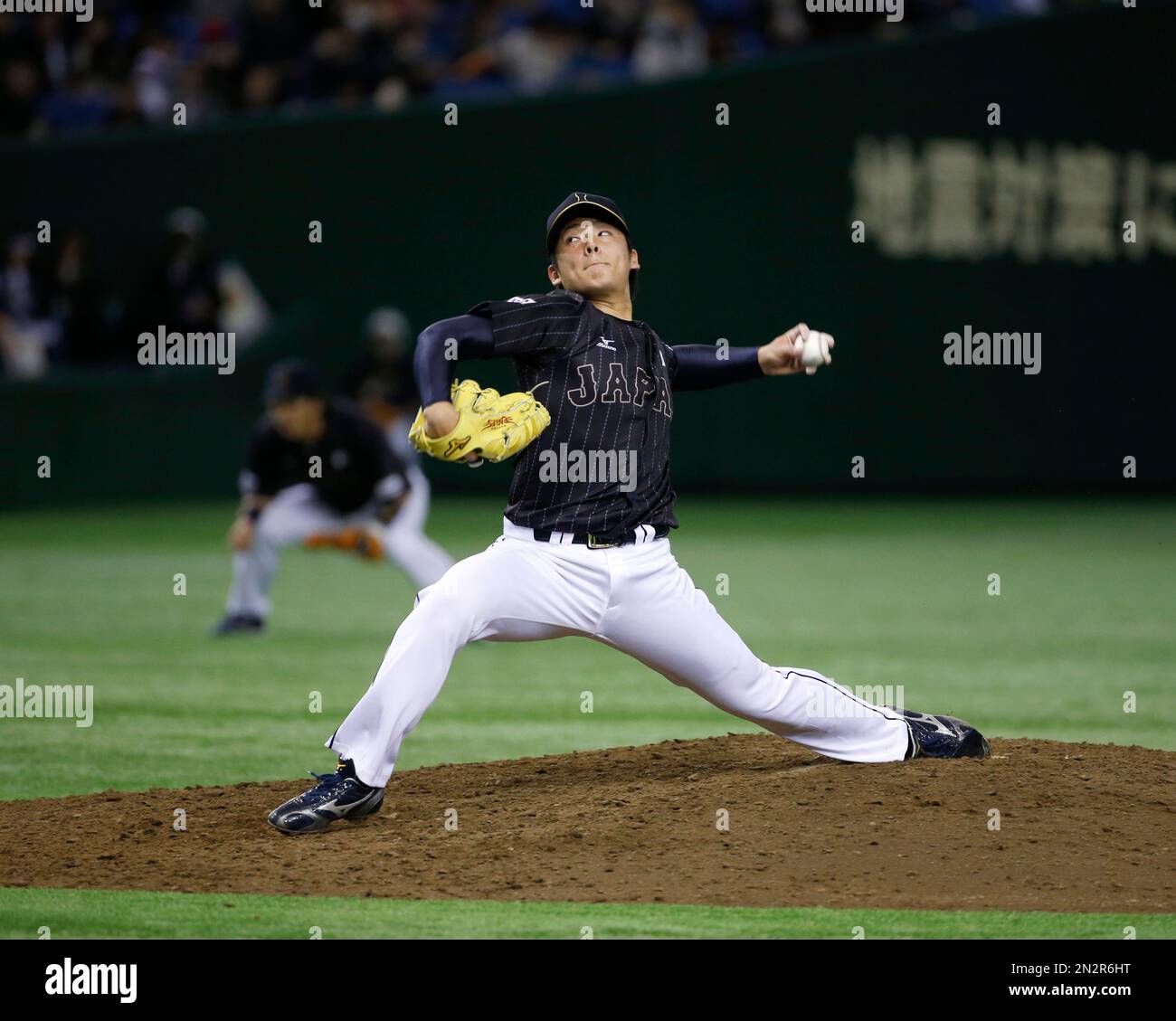 Team Japan's Yuki Matsui winds up to pitch against Team Europe in the ...