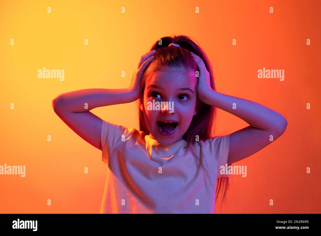 Positive shock. Portrait of little girl, child posing with emotional ...