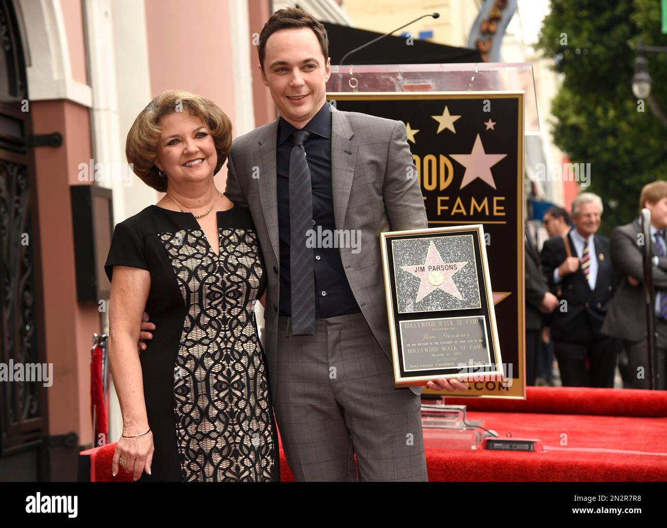 Jim Parsons, right, and Judy Parsons, pose on stage as the actor is ...