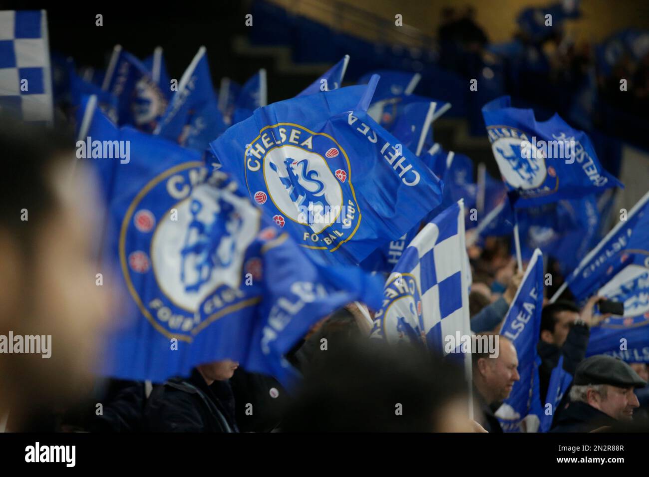 Fans of Chelsea cheer their team in the stands by waving flags prior to ...
