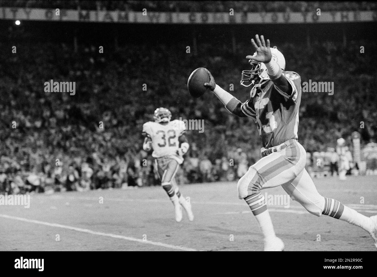 Miami Dolphins wide receiver Mark Layton (83) runs a pass from ...
