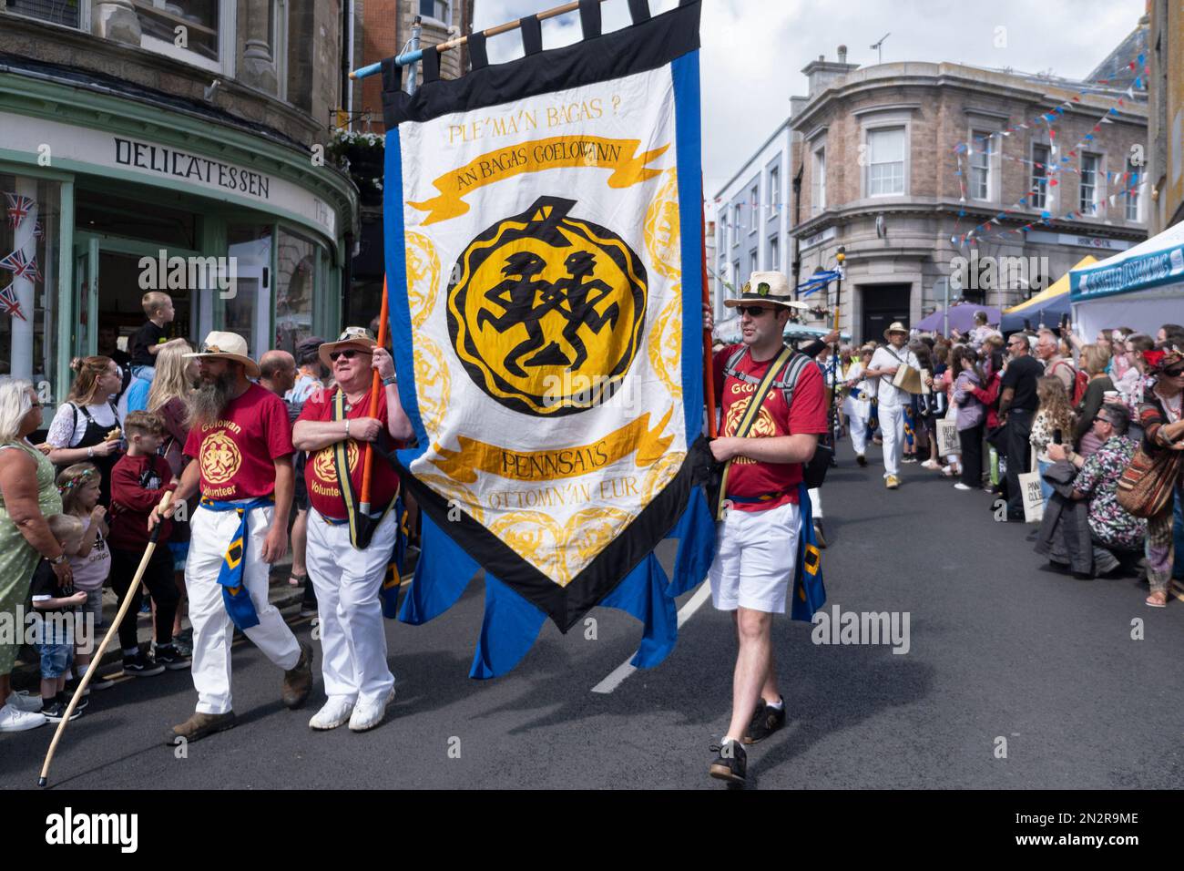 The banner for the Golowan Festival leading the colourful Mazey Day ...