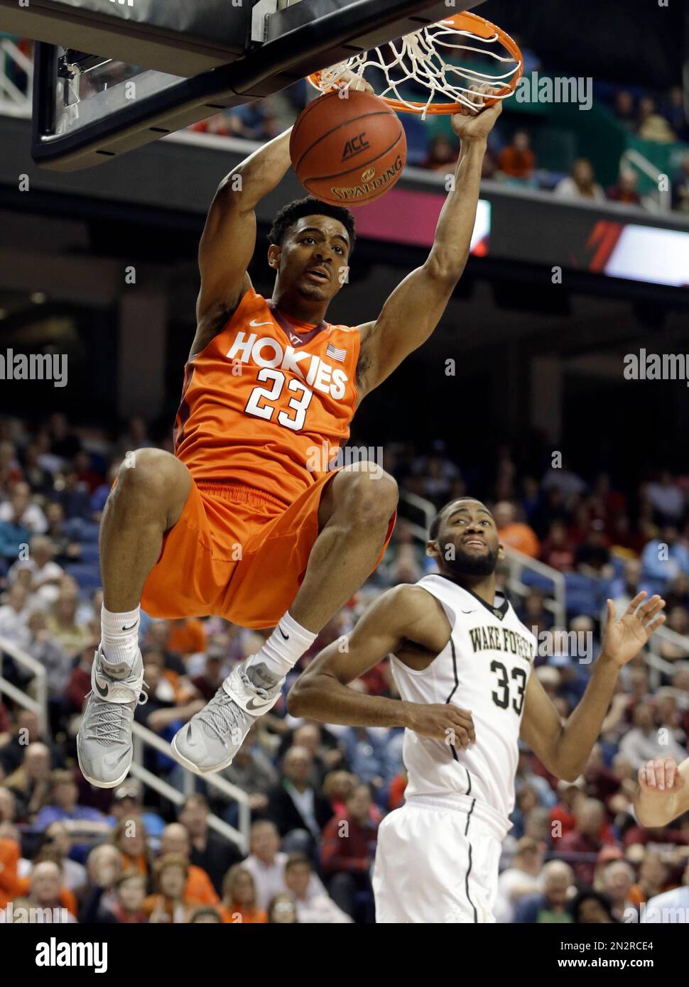 Virginia Tech's Jalen Hudson (23) dunks as Wake Forest's Aaron Rountree ...