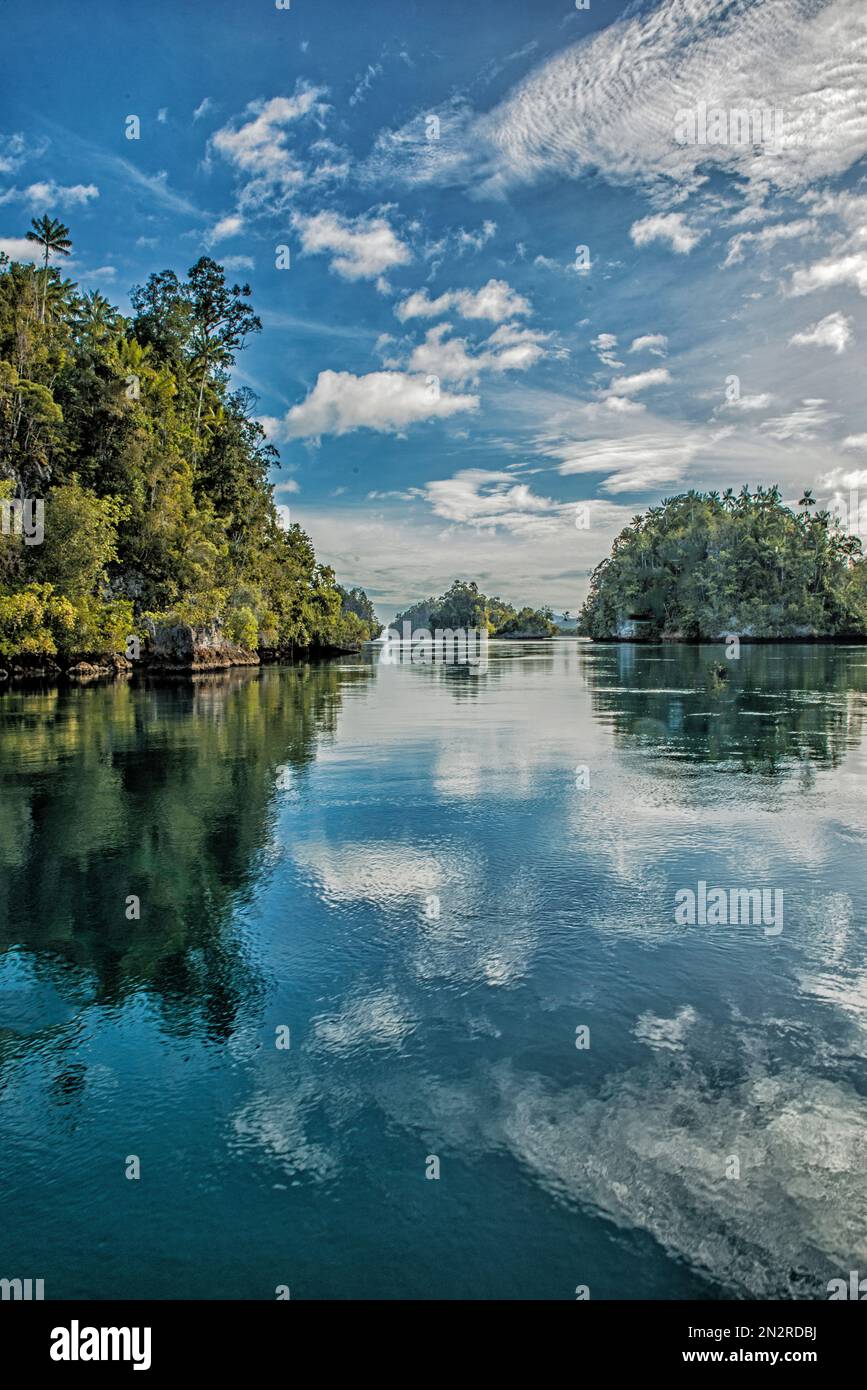 Karst rock reflections in ocean, Raja Ampat, New Guinea, West Papua ...
