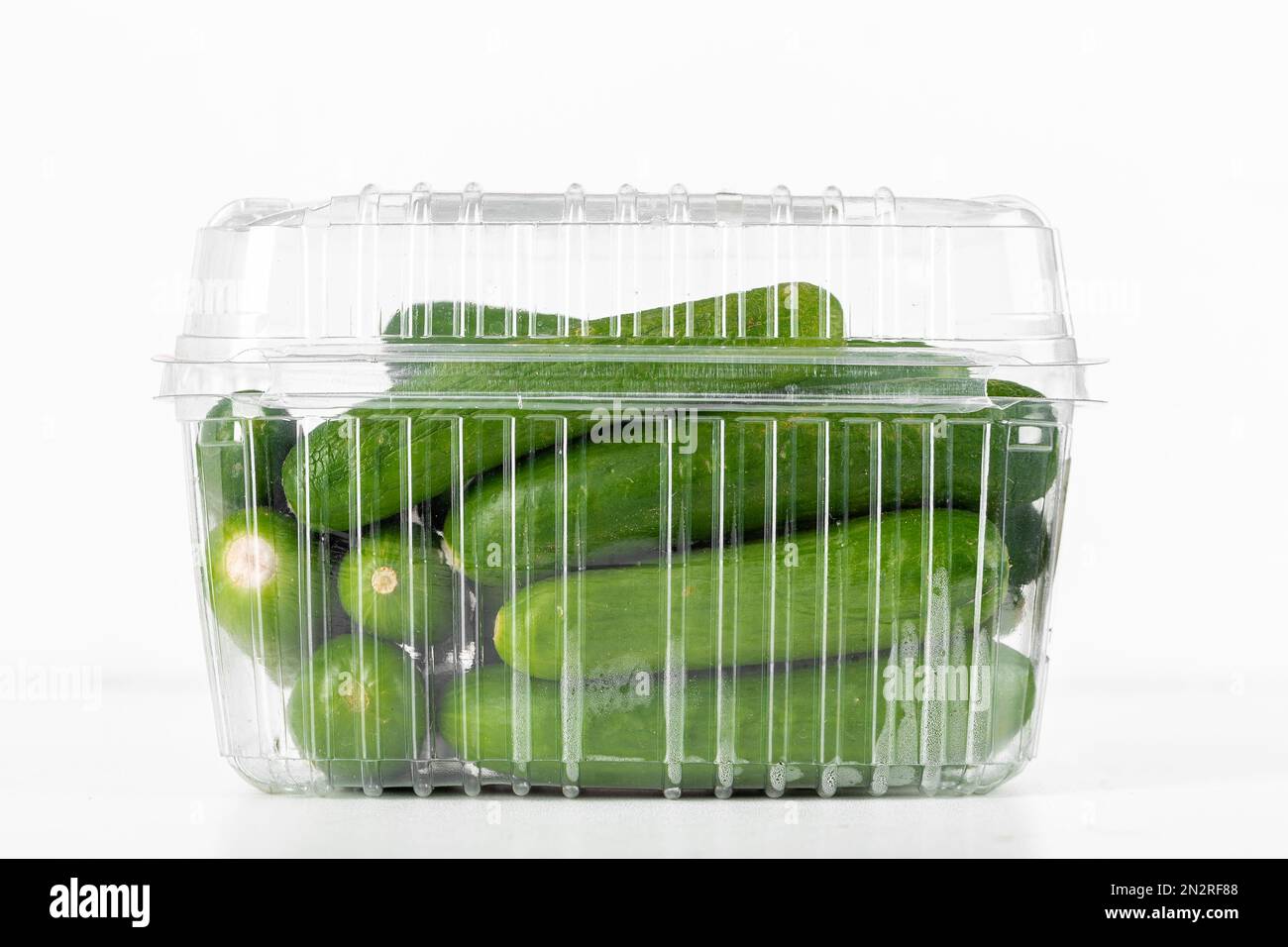 packaged cucumber on a white background Stock Photo - Alamy