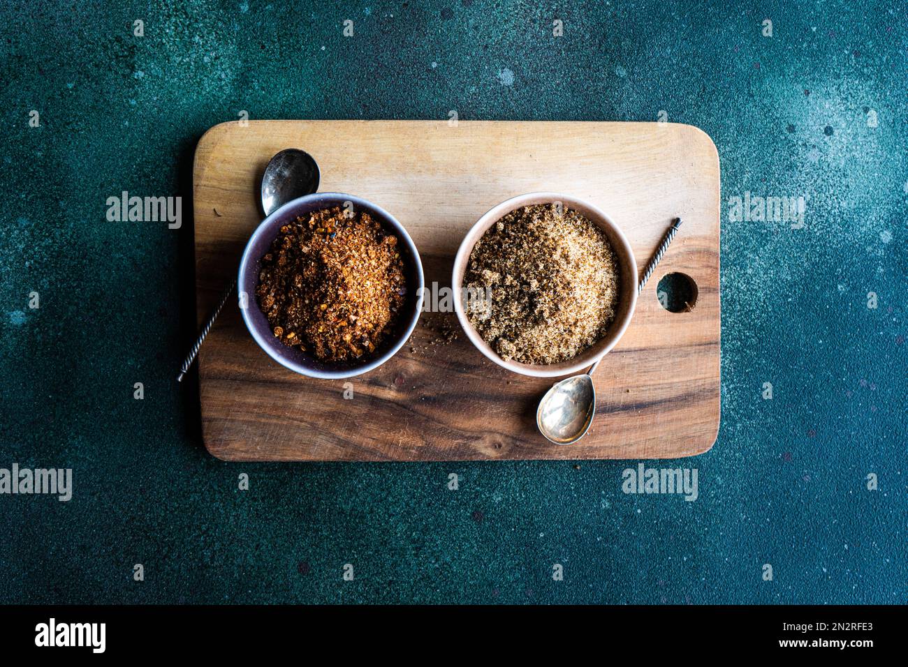 Overhead view of two bowls of Georgian Dry Red Adjika and Svanuri salt ...