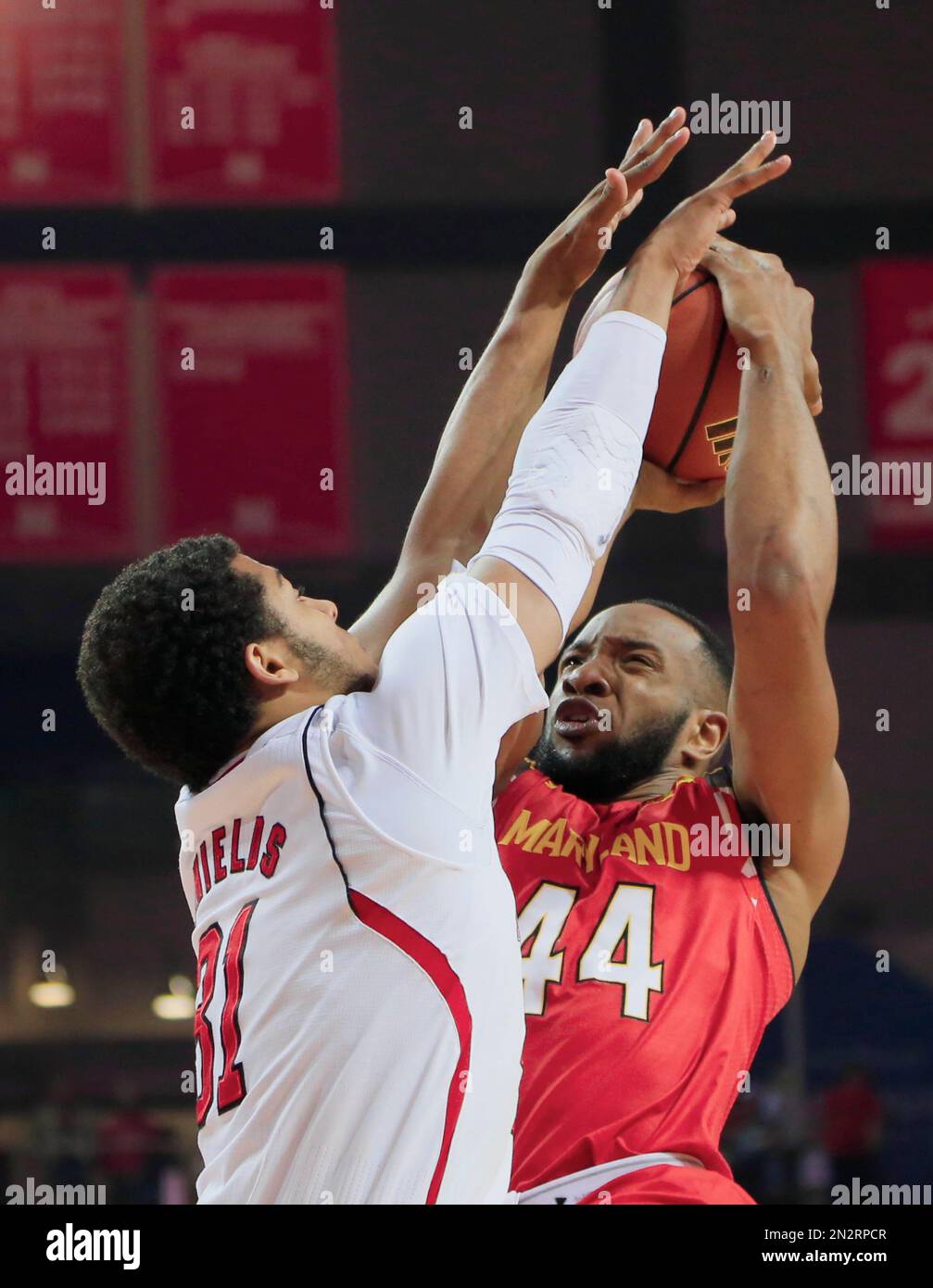 Maryland's Dez Wells (44) is defended by Nebraska guard Shavon Shields ...
