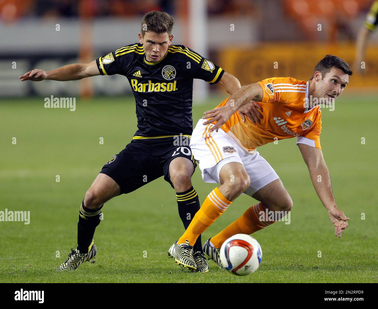 Houston Dynamo forward Will Bruin (12) and Columbus Crew midfielder Wil ...