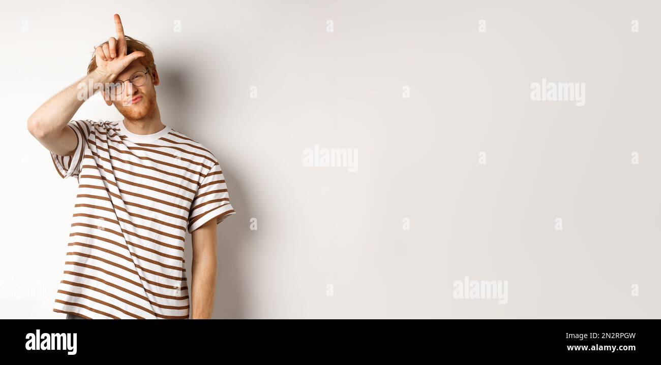 Sassy and arrogant redhead man scolding lost team, showing loser ...