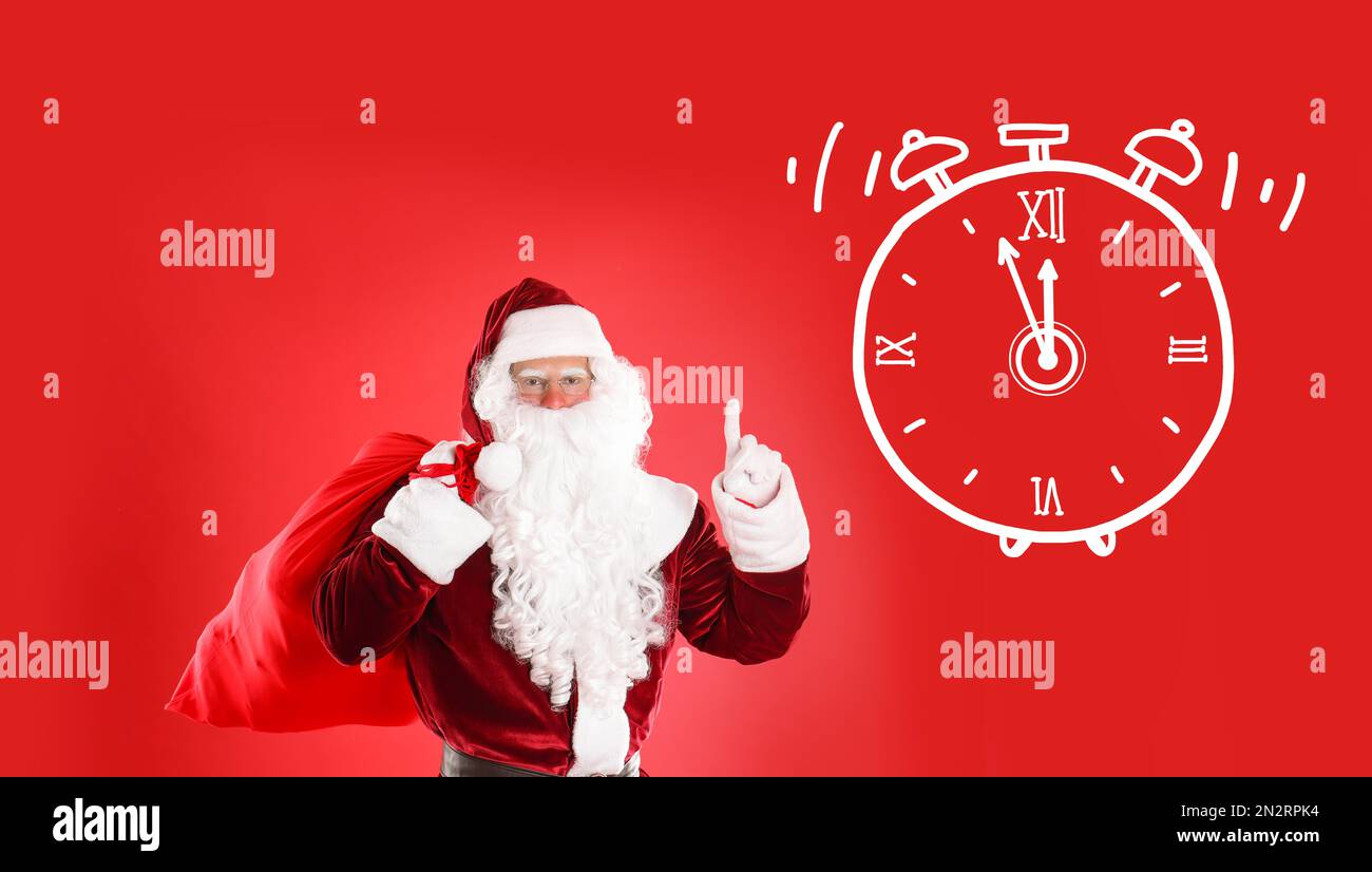 Christmas countdown. Clock showing five minutes to midnight near Santa ...