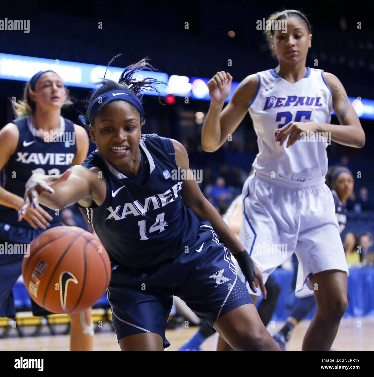 Xavier forward Briana Glover (14) tries to save the ball from going out ...