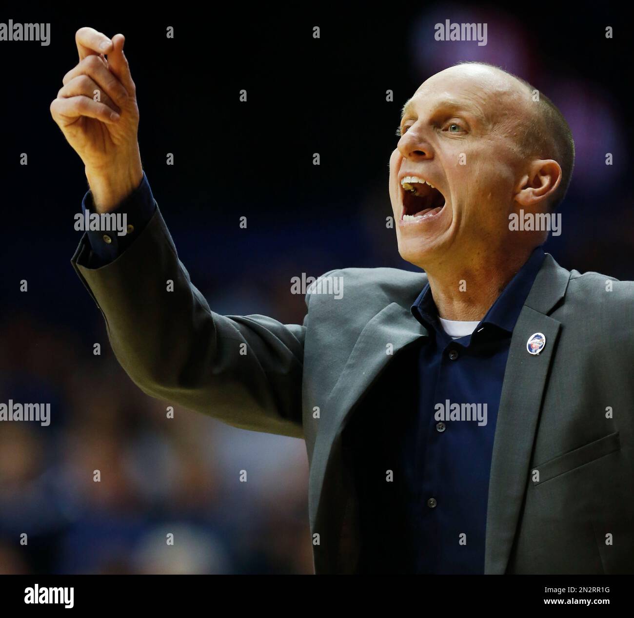 Xavier head coach Brian Neal directs his team against DePaul during the ...