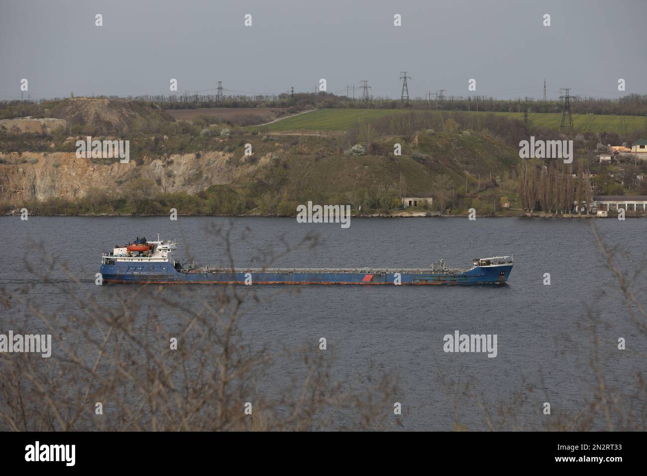 empty dry-cargo ship sailing on the river Stock Photo - Alamy