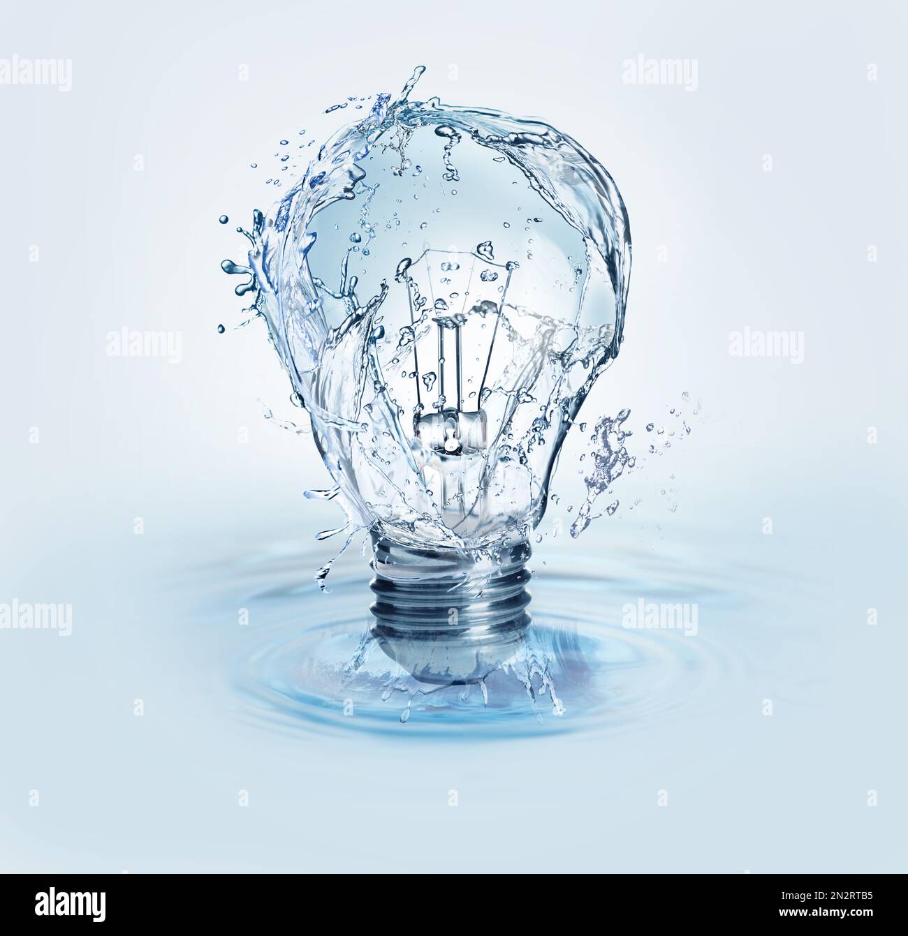 Light bulb with water splashes on light background. Alternative energy ...