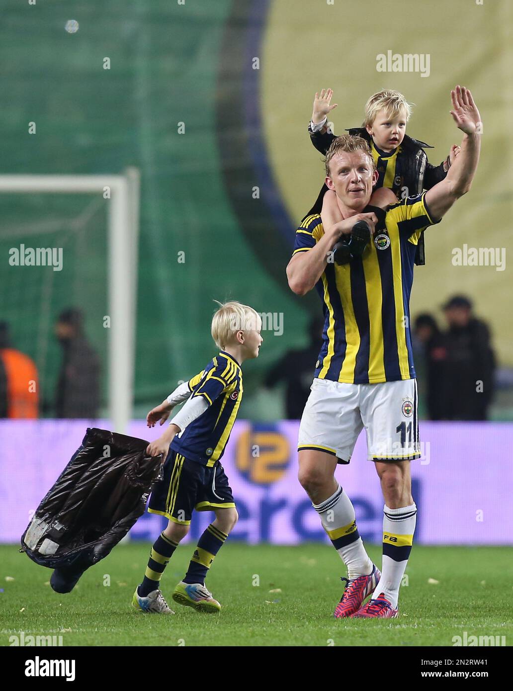 Fenerbahce's Dirk Kuyt celebrates with two of his three children after ...