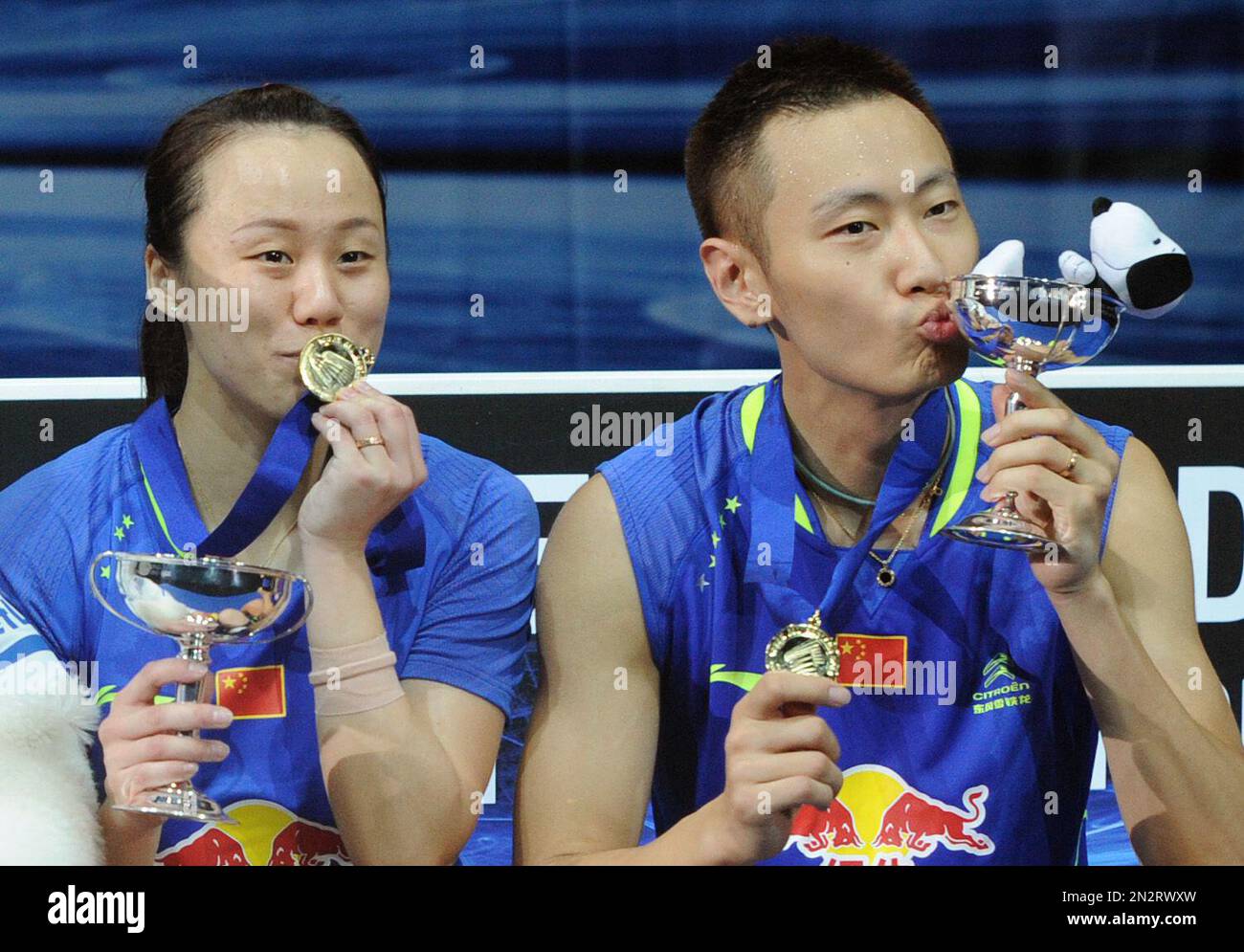 China’s Zhang Nan, right, and Zhao Yunlei celebrate on the podium with ...