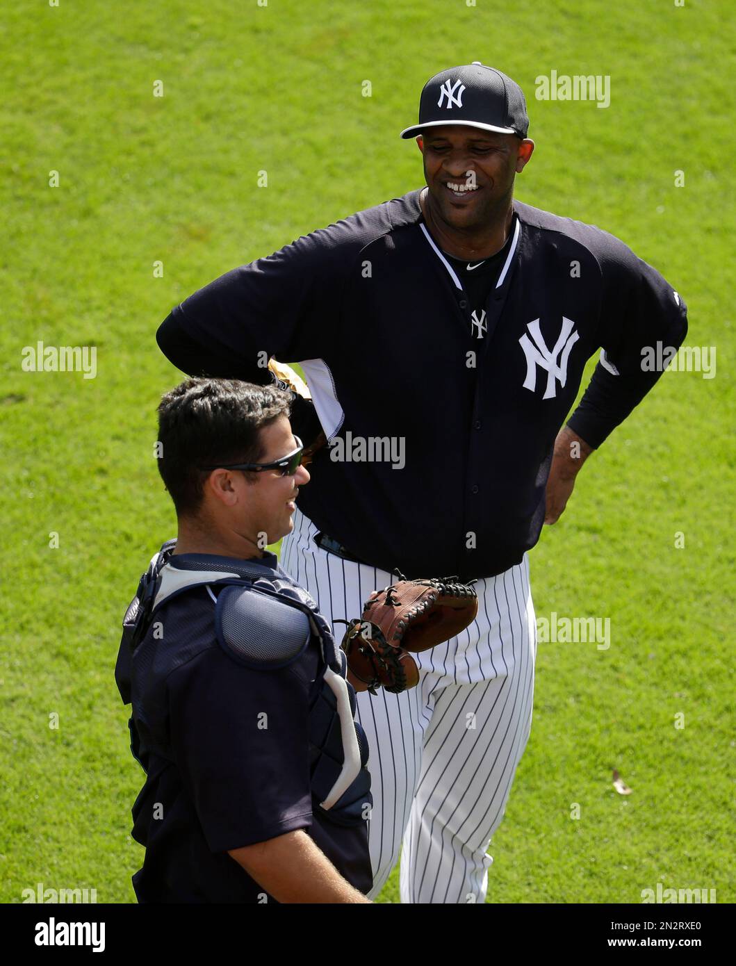 New York Yankees starting pitcher CC Sabathia, right, talks with ...
