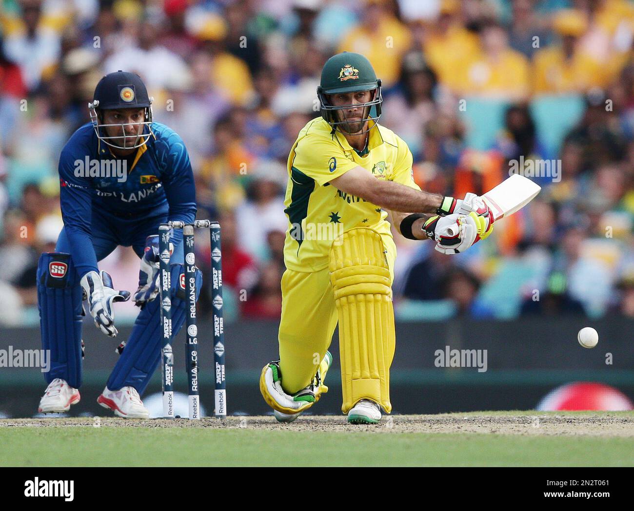 Australian batsman Glenn Maxwell looks to make a reverse sweep as Sri ...