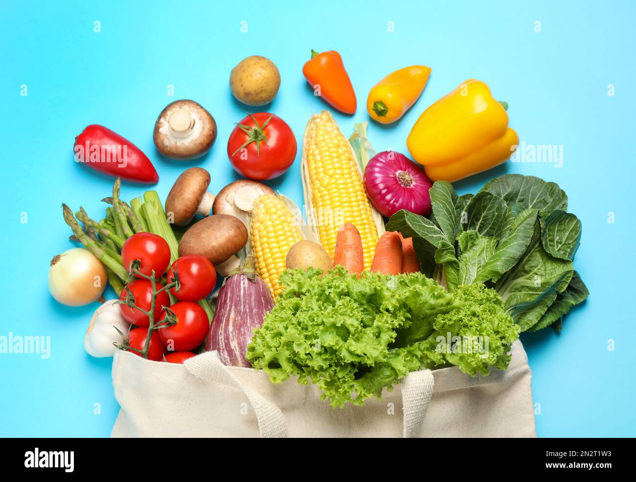 Different fresh vegetables on light blue background, flat lay Stock ...