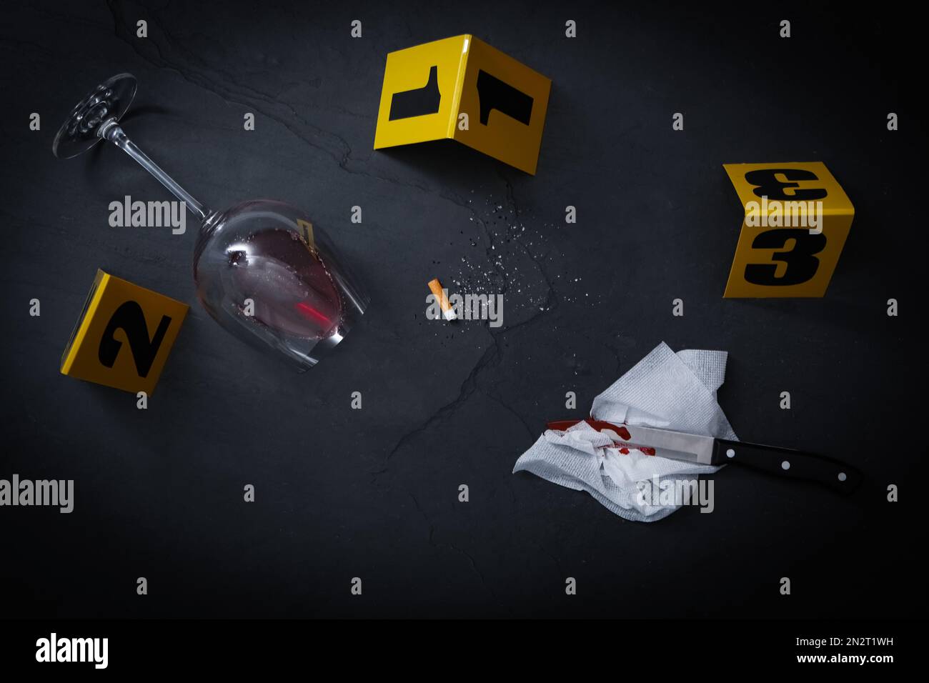 Flat lay composition with evidences and crime scene markers on black ...