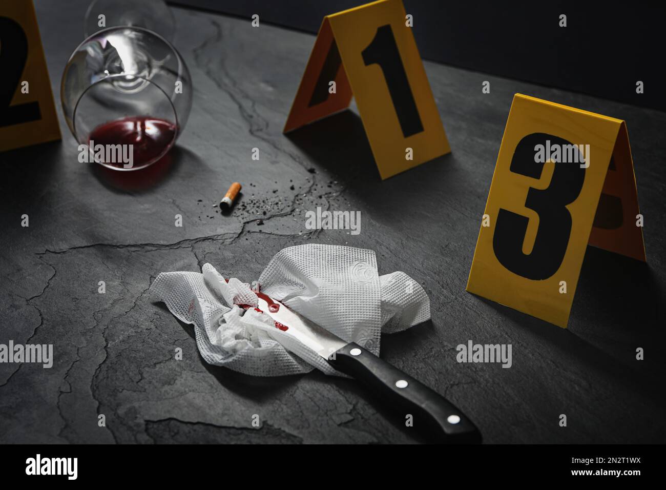 Crime scene markers and evidences on black background, closeup Stock ...