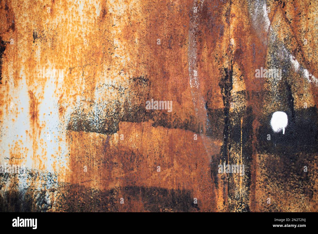 There are abstract drawings of black paint on a rusty iron wall Stock ...