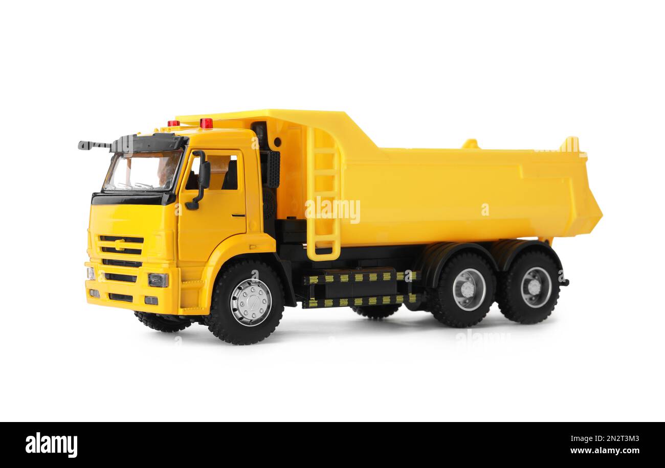 Yellow toy tipper truck isolated on white Stock Photo - Alamy