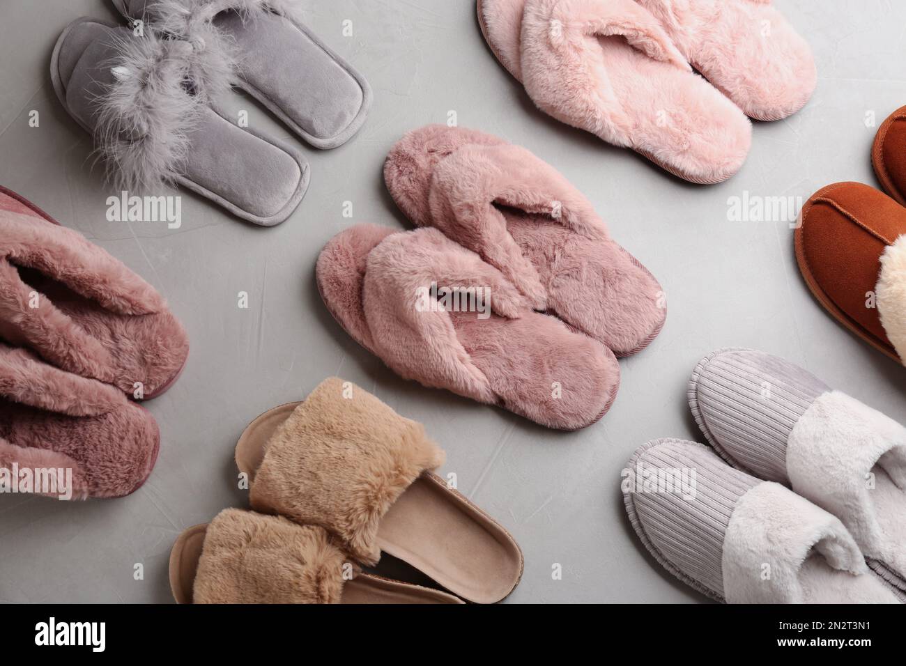 Many different soft slippers on light grey background, flat lay Stock ...
