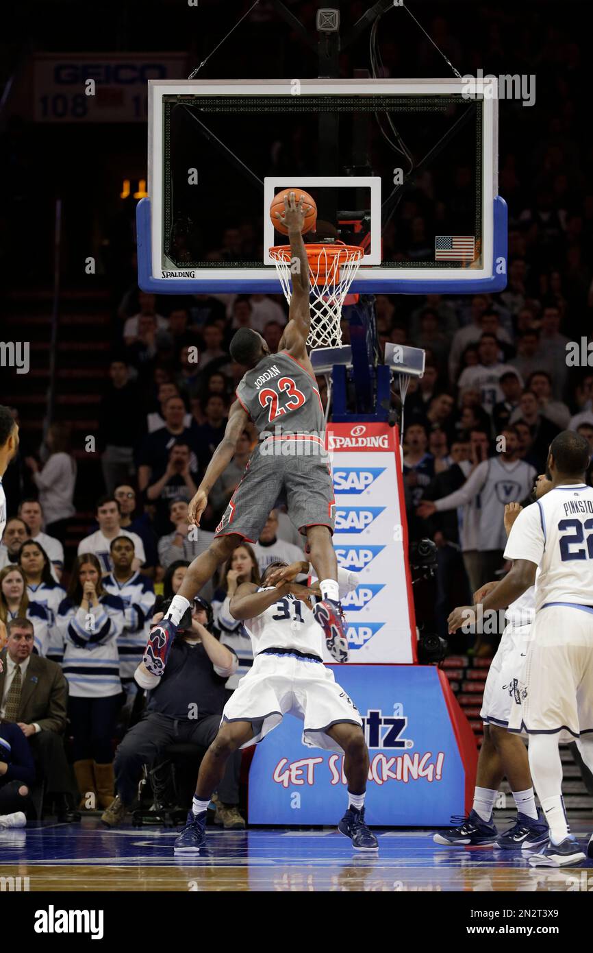 St. John's Rysheed Jordan (23) goes up for a dunk over Villanova's ...