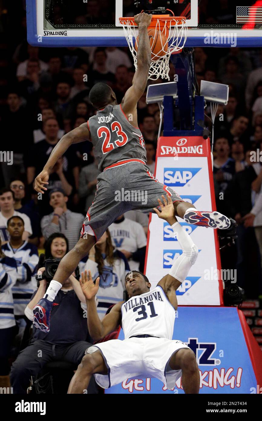 St. John's Rysheed Jordan (23) goes up for a dunk over Villanova's ...