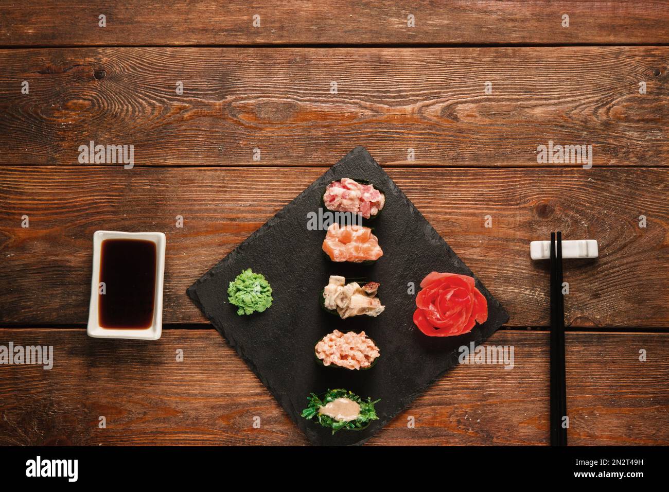 Japanese sushi. Fresh set of gunkan on black slate Stock Photo - Alamy