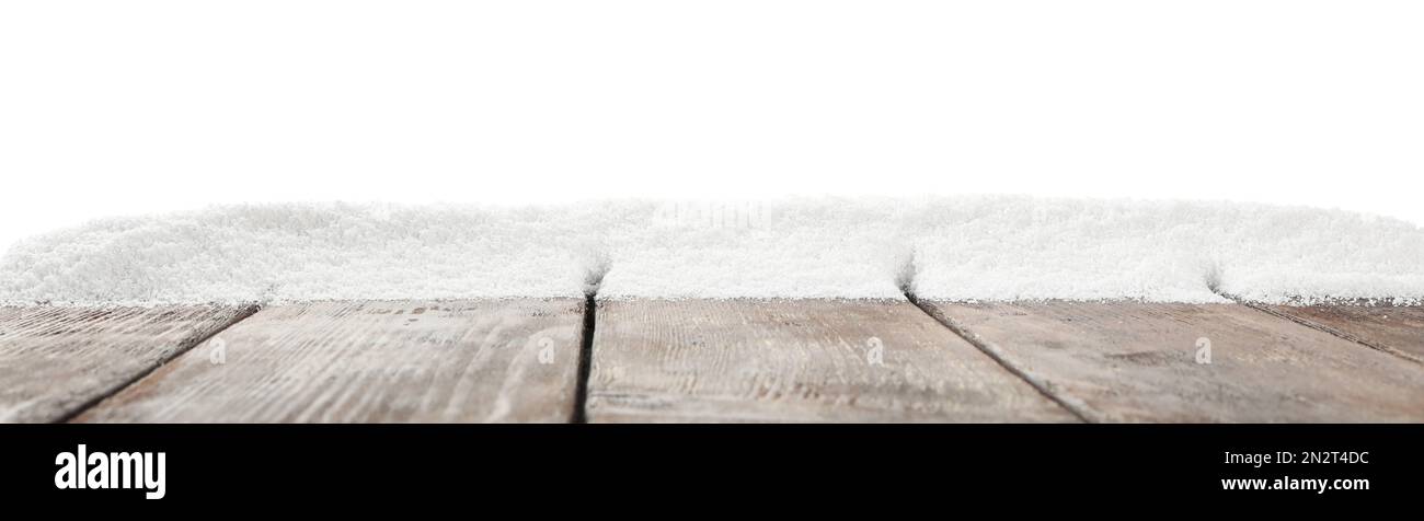 Artificial snow on wooden table against white background. Christmas ...