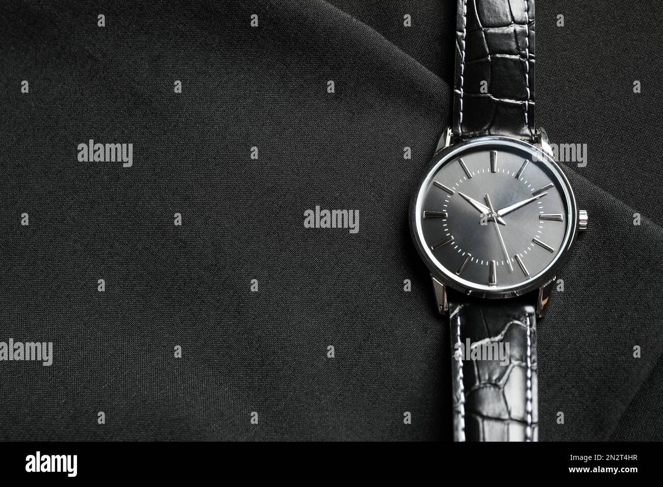 Luxury wrist watch on black fabric, top view. Space for text Stock ...